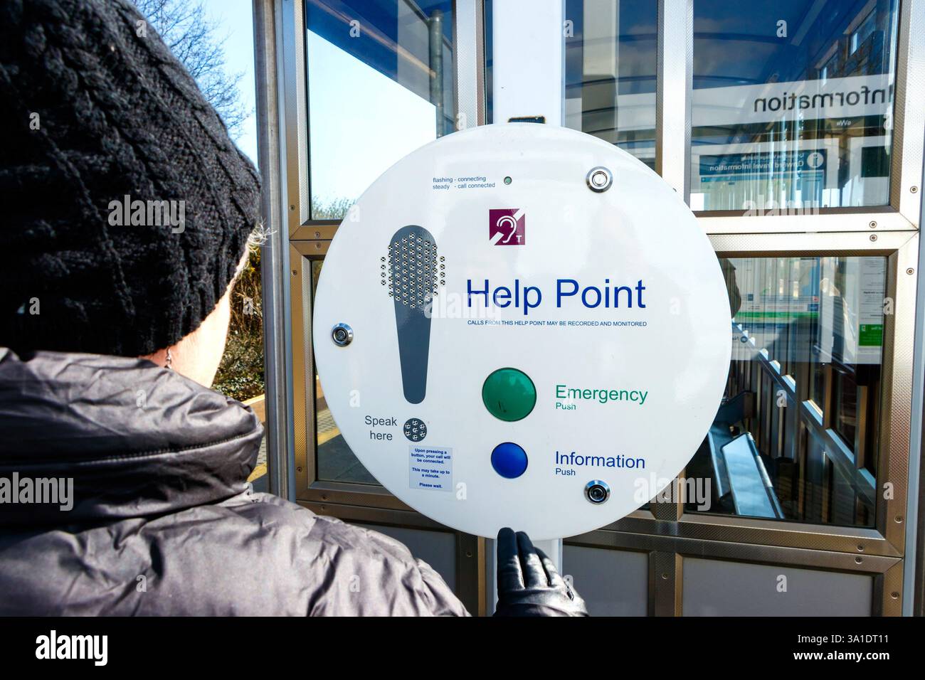 woman using help point on platform at Exeter Central Railway station ...