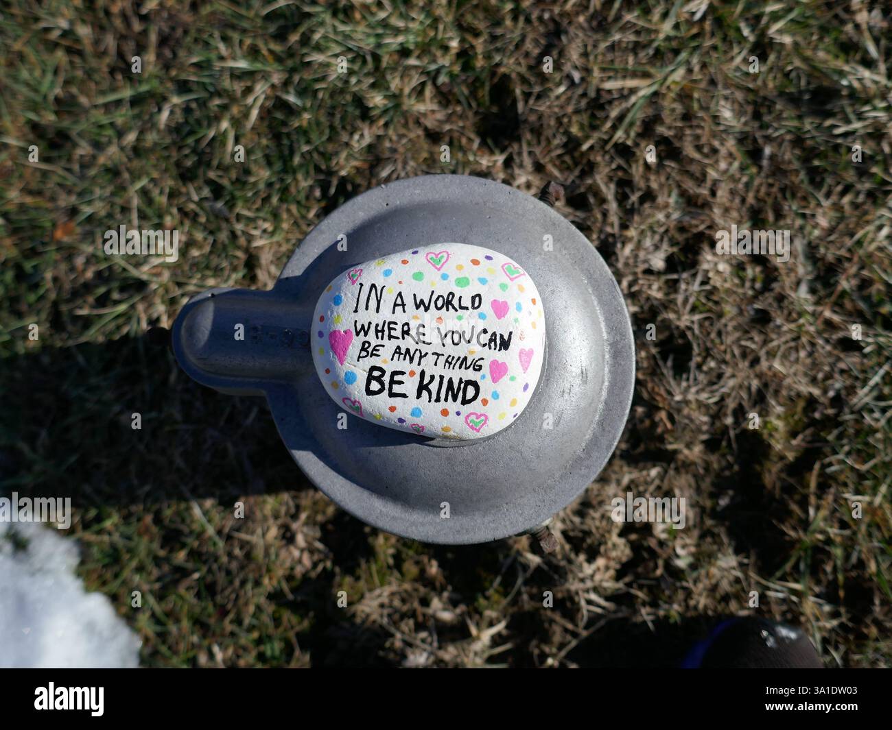 Be kind kindness rock on top of outdoor patio light Stock Photo - Alamy