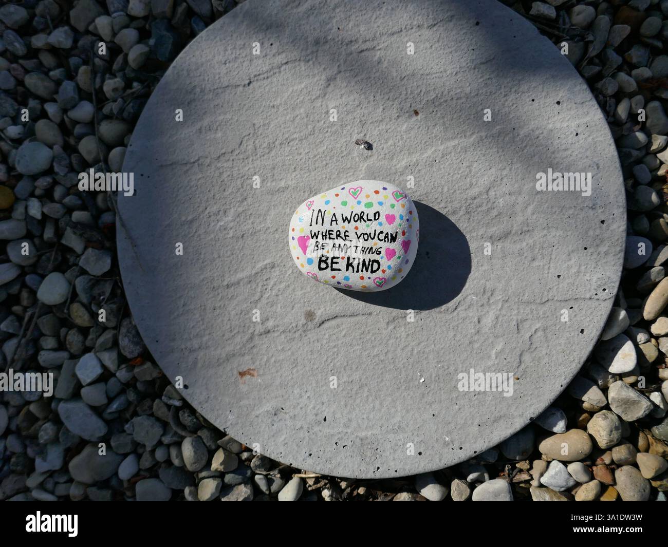 Be kind kindness rock on round patio stone Stock Photo - Alamy