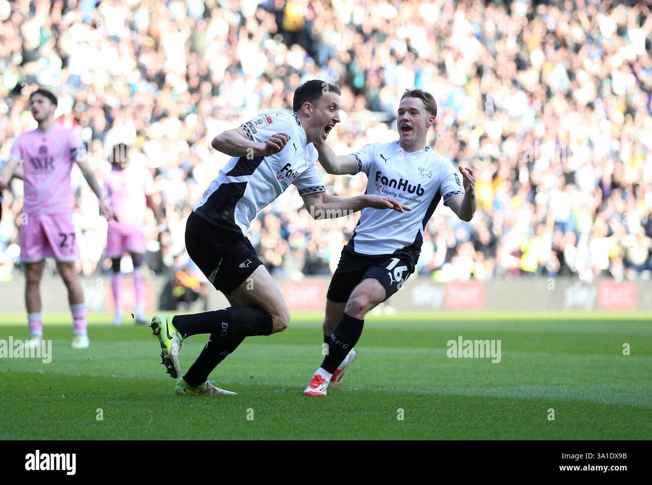 Derby County's Craig Forsyth (left) celebrates with Liam Thompson after ...