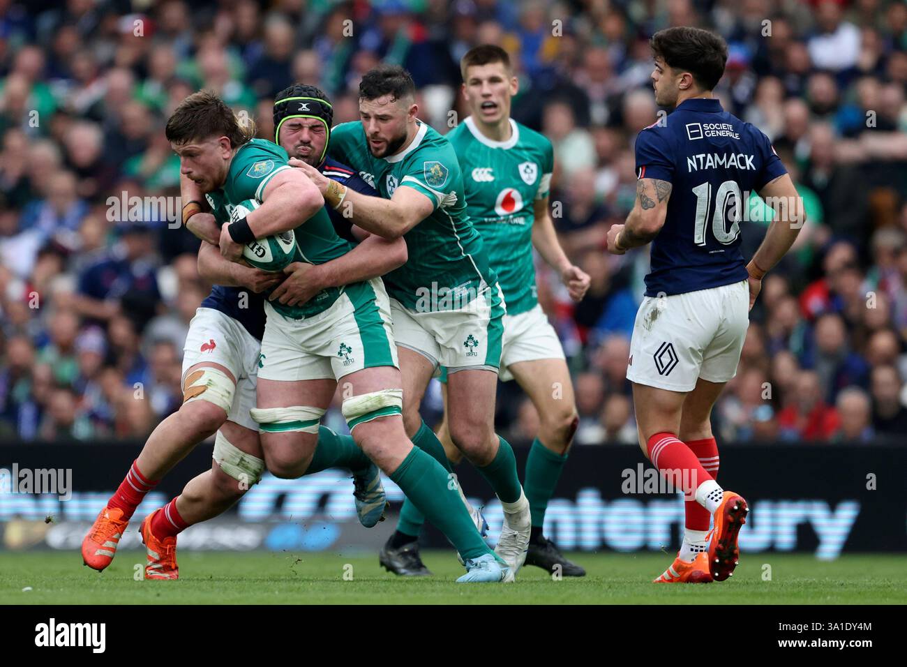 Ireland's Joe McCarthy, left, is tackled by France's Gregory Alldritt ...