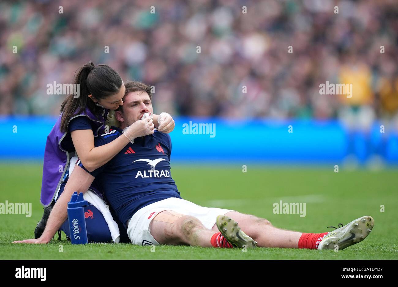 France's Pierre Louis Barassi receives treatment for an injury during ...