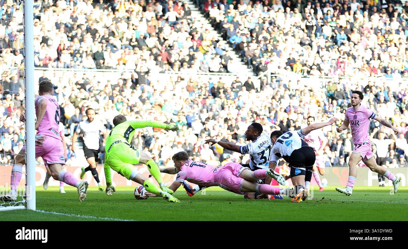 Derby County's Ebou Adams (centre right) scores his sides second goal ...
