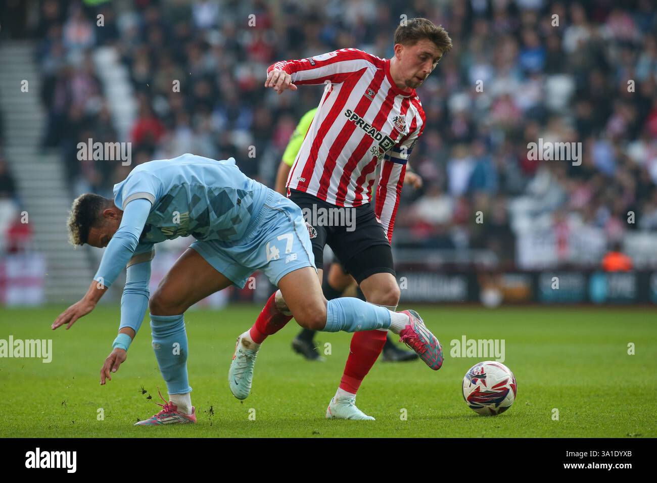 Sunderland's Dan Neil tackles Cardiff City's Callum Robinson during the ...