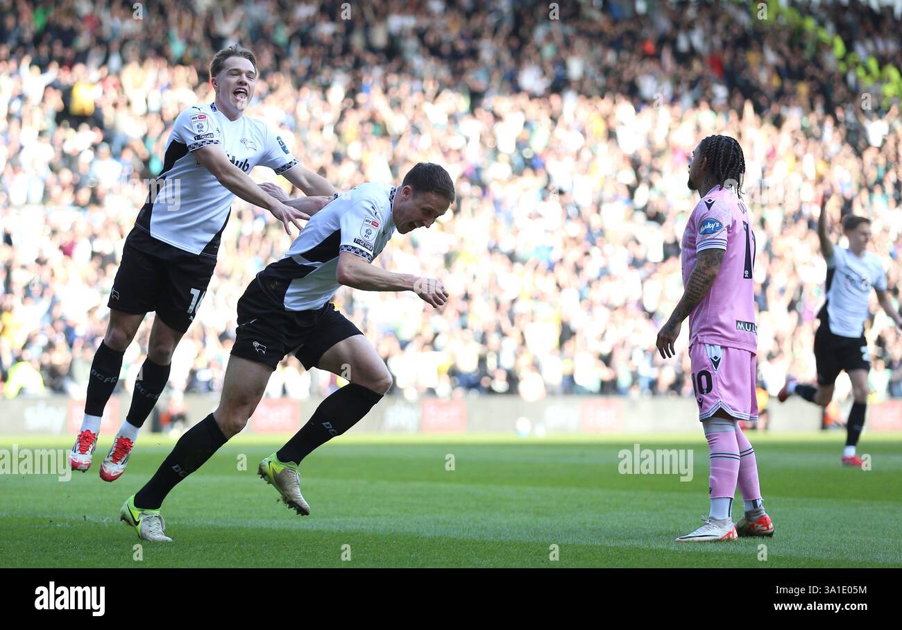 Derby County's Craig Forsyth (second left) celebrates with Liam ...