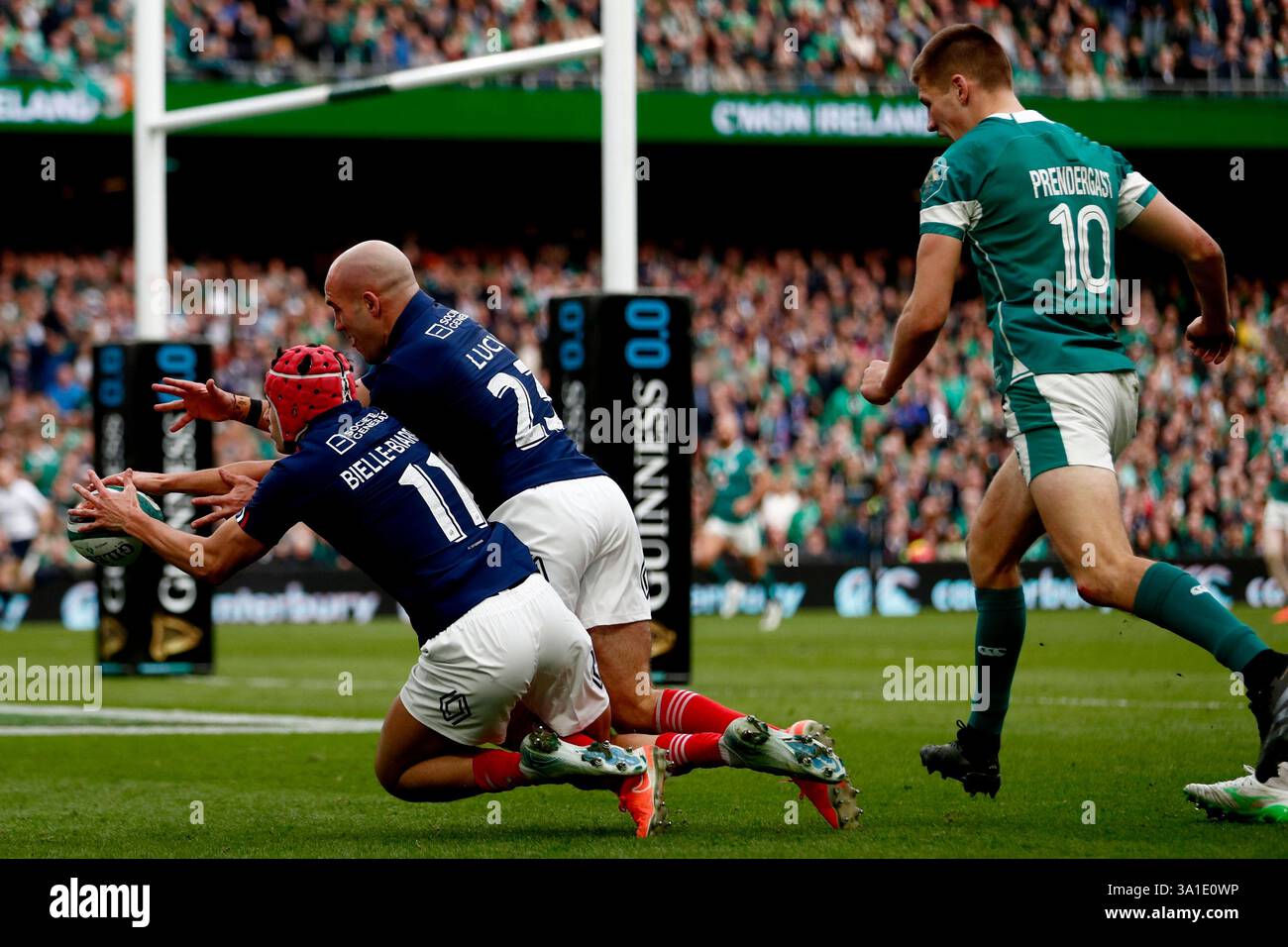 France's Louis Bielle-Biarrey, left, scores a try during the Six ...