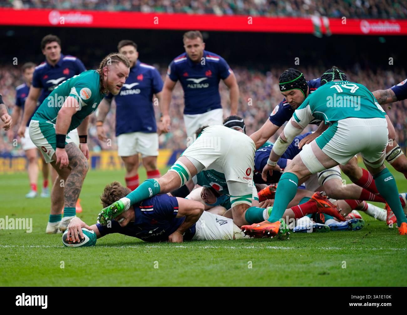 France's Oscar Jegou scores their side's fourth try of the game during ...