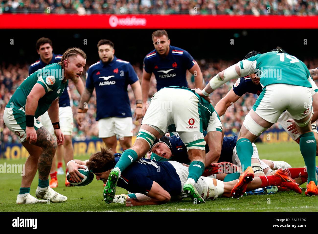 France's Oscar Jegou, bottom, scores a try during the Six Nations rugby ...