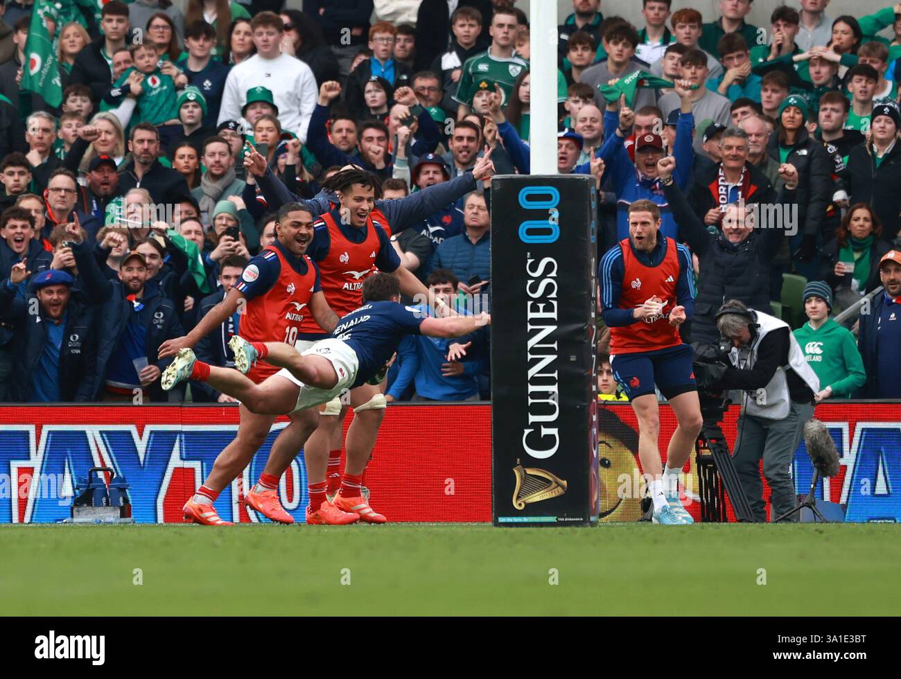 France's Damian Penaud scores their side's fifth try of the game during ...