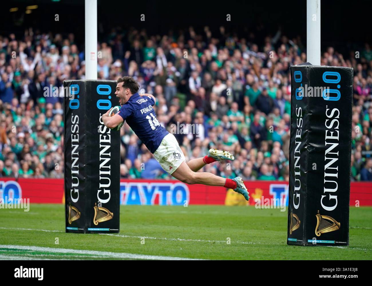 France's Damian Penaud scores their side's fifth try of the game during ...