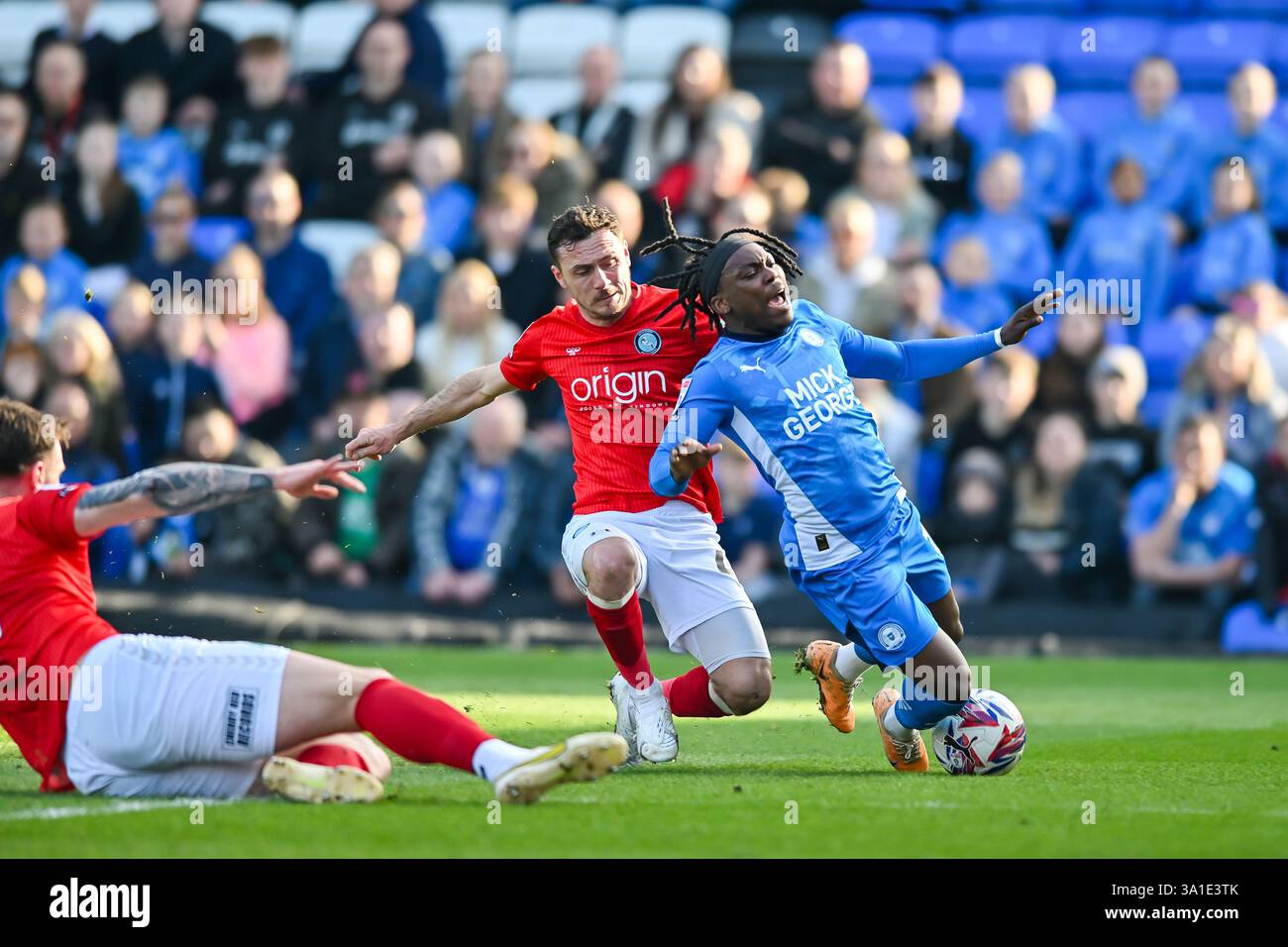 Abraham Odoh (10 Peterborough United) challenged by Josh Scowen (4 ...