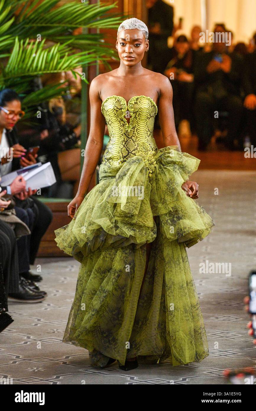 A model walks the runway during the Serbia Fashion Week Runway ...
