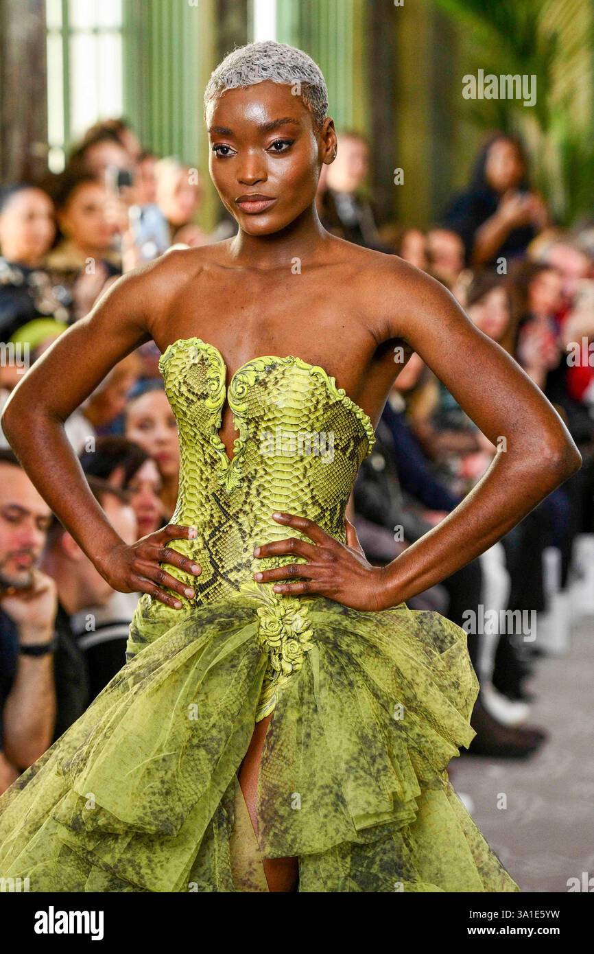 A model walks the runway during the Serbia Fashion Week Runway ...