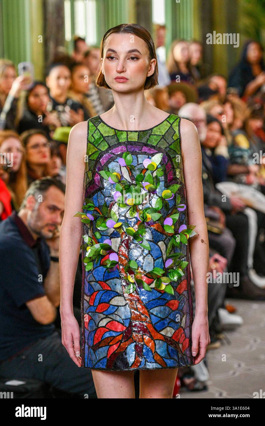 A model walks the runway during the Serbia Fashion Week Runway ...