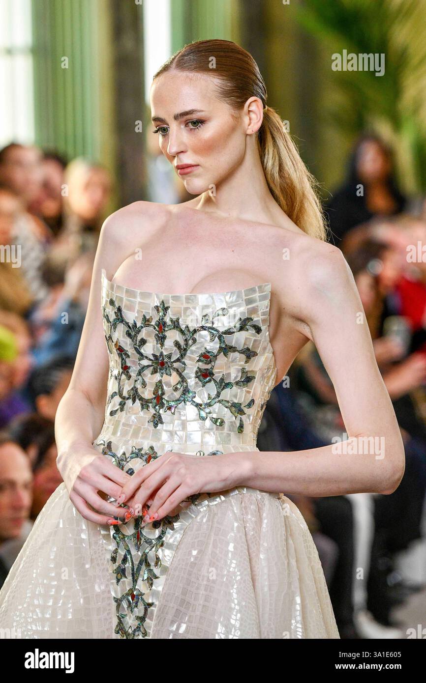 A model walks the runway during the Serbia Fashion Week Runway ...