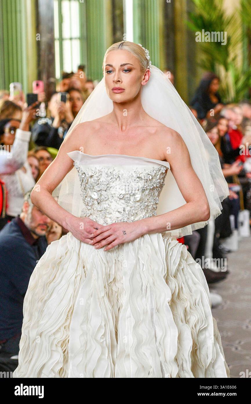 A model walks the runway during the Serbia Fashion Week Runway ...