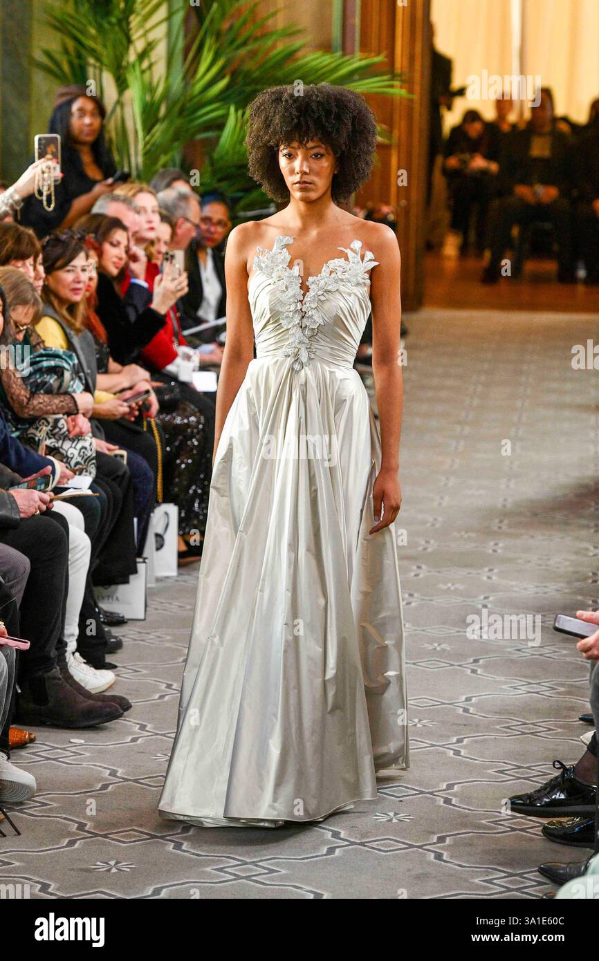 A model walks the runway during the Serbia Fashion Week Runway ...