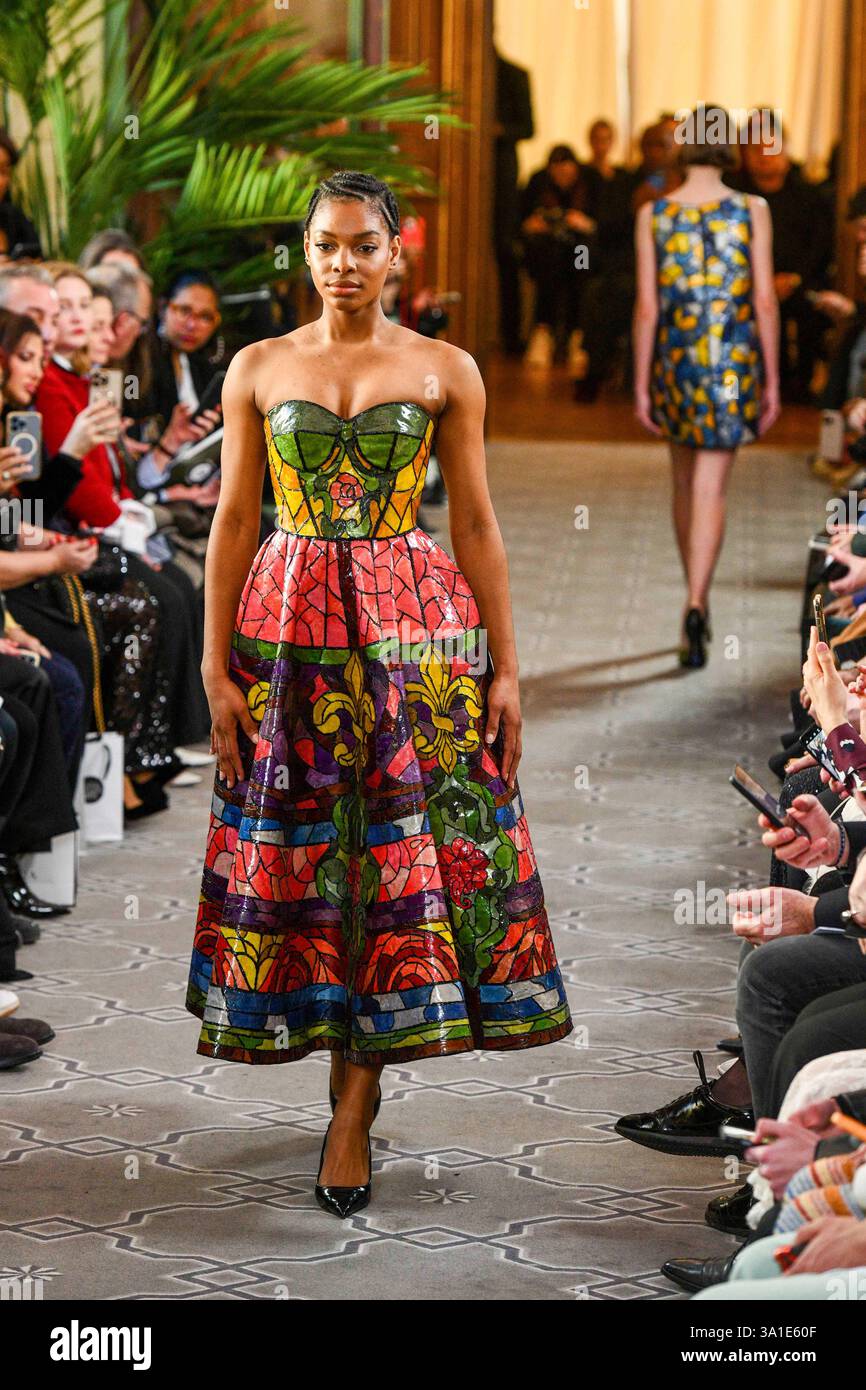 A model walks the runway during the Serbia Fashion Week Runway ...