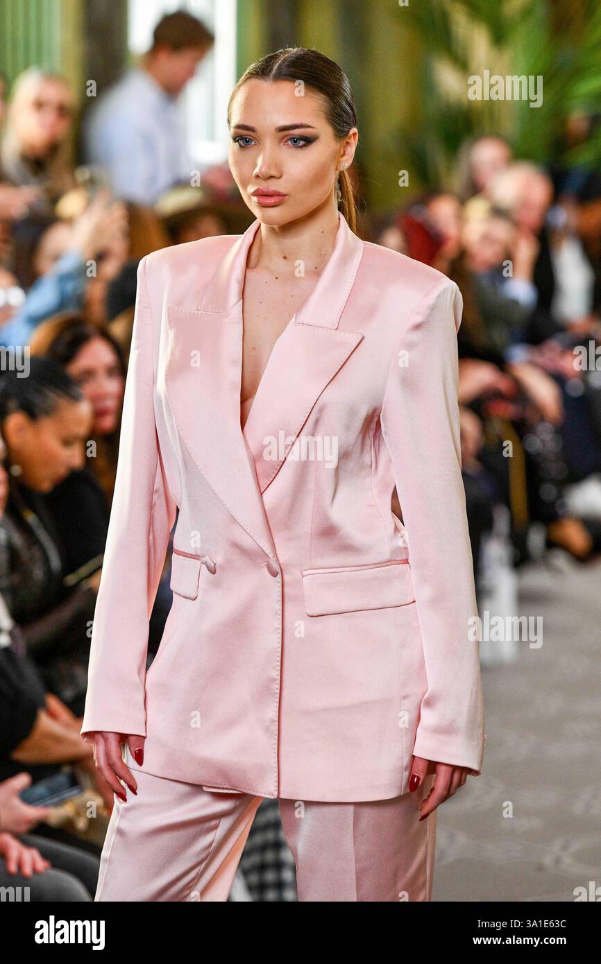 A model walks the runway during the Serbia Fashion Week Runway ...