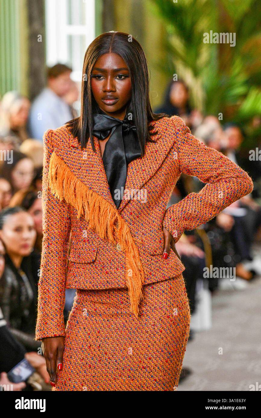 A model walks the runway during the Serbia Fashion Week Runway ...