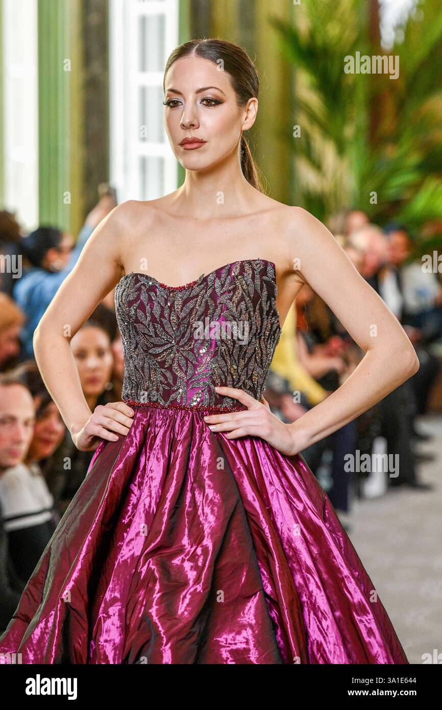 A model walks the runway during the Serbia Fashion Week Runway ...