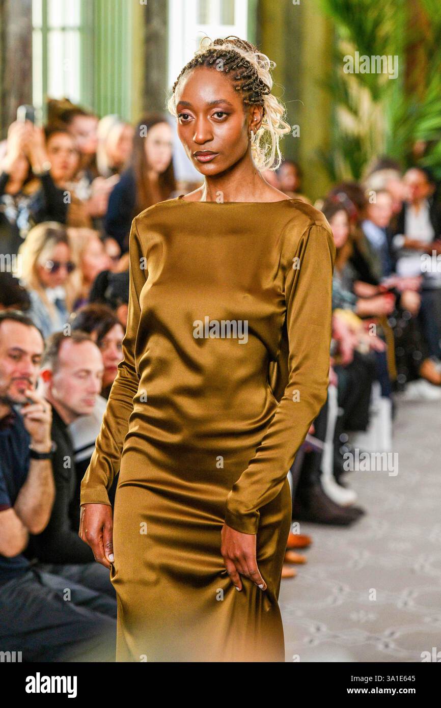 A model walks the runway during the Serbia Fashion Week Runway ...