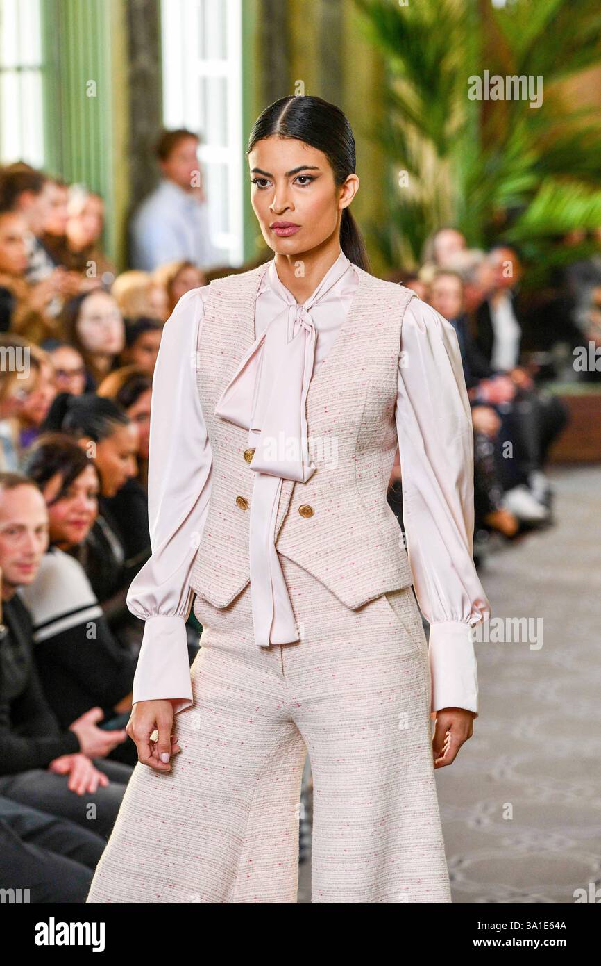 A model walks the runway during the Serbia Fashion Week Runway ...