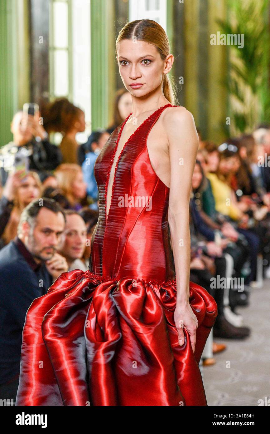 A model walks the runway during the Serbia Fashion Week Runway ...