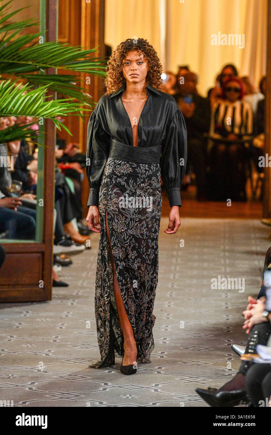 A model walks the runway during the Serbia Fashion Week Runway ...