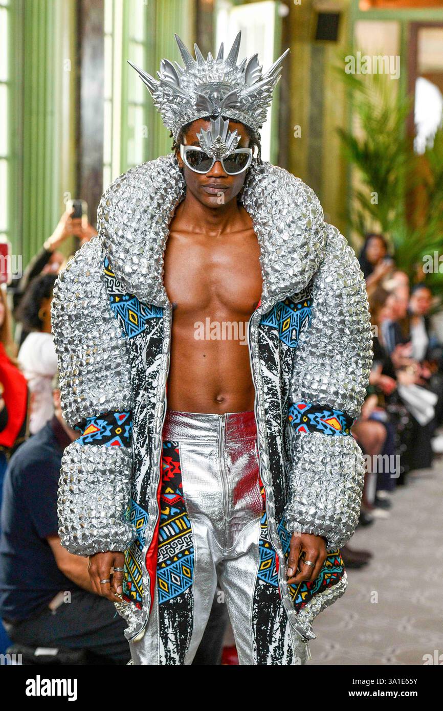 A model walks the runway during the Serbia Fashion Week Runway ...