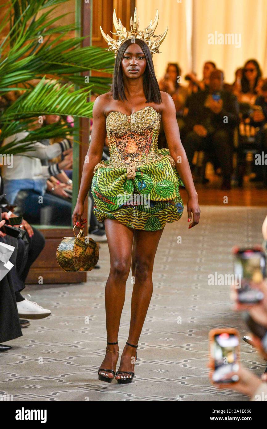A model walks the runway during the Serbia Fashion Week Runway ...
