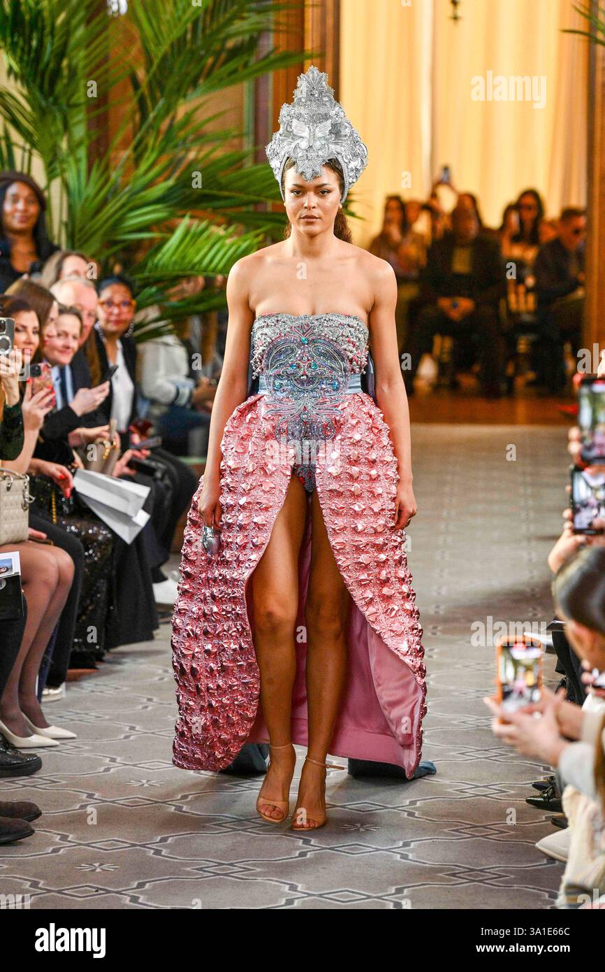 A model walks the runway during the Serbia Fashion Week Runway ...