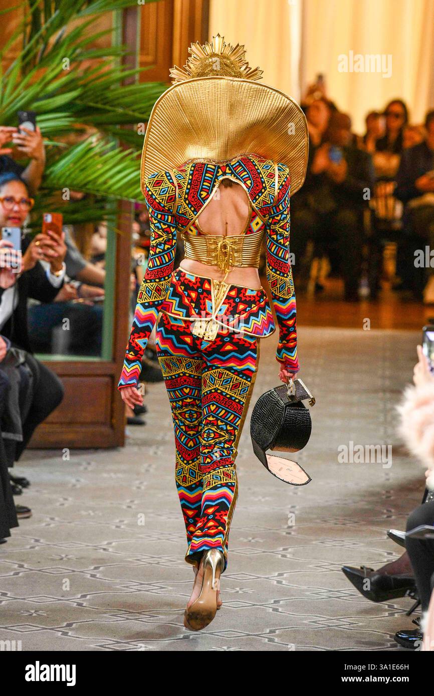 A model walks the runway during the Serbia Fashion Week Runway ...