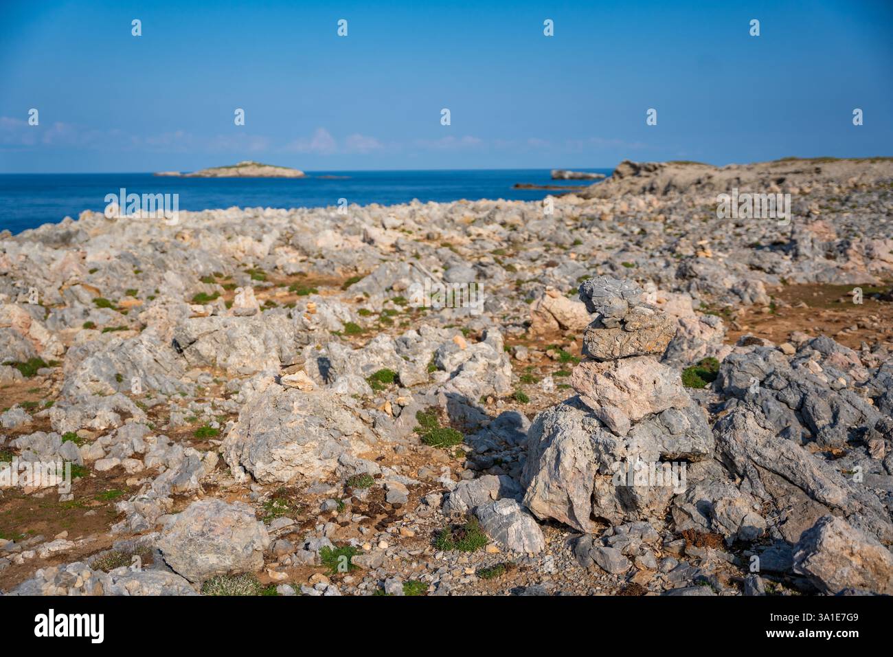 Stone cairns built by travelers stand on the northeasternmost cape of ...