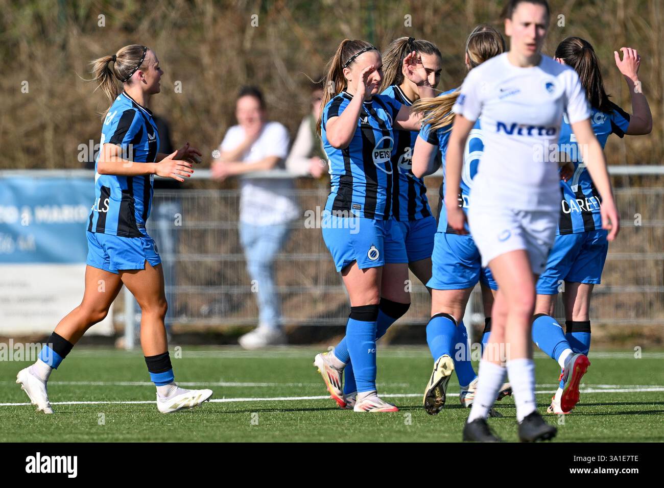 Aalter, Belgium. 08th Mar, 2025. Davinia Vanmechelen (25) of Club YLA pictured celebrating with ...
