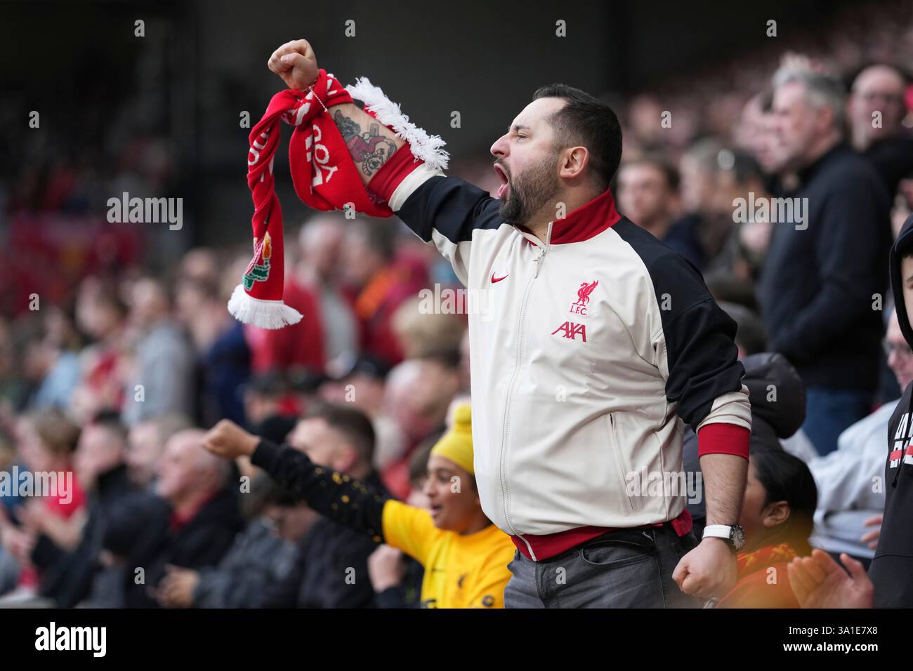 Liverpool fan cheers during the English Premier League soccer match ...