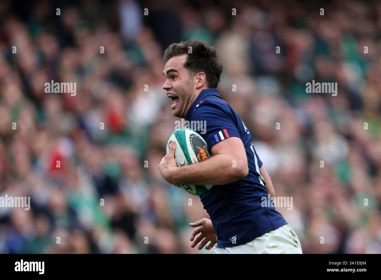 France's Damian Penaud runs to score a try during the Six Nations rugby ...