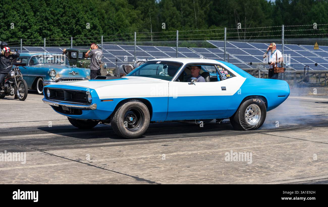 A pony car Plymouth Barracuda (1970) on the starting line. Getting ...