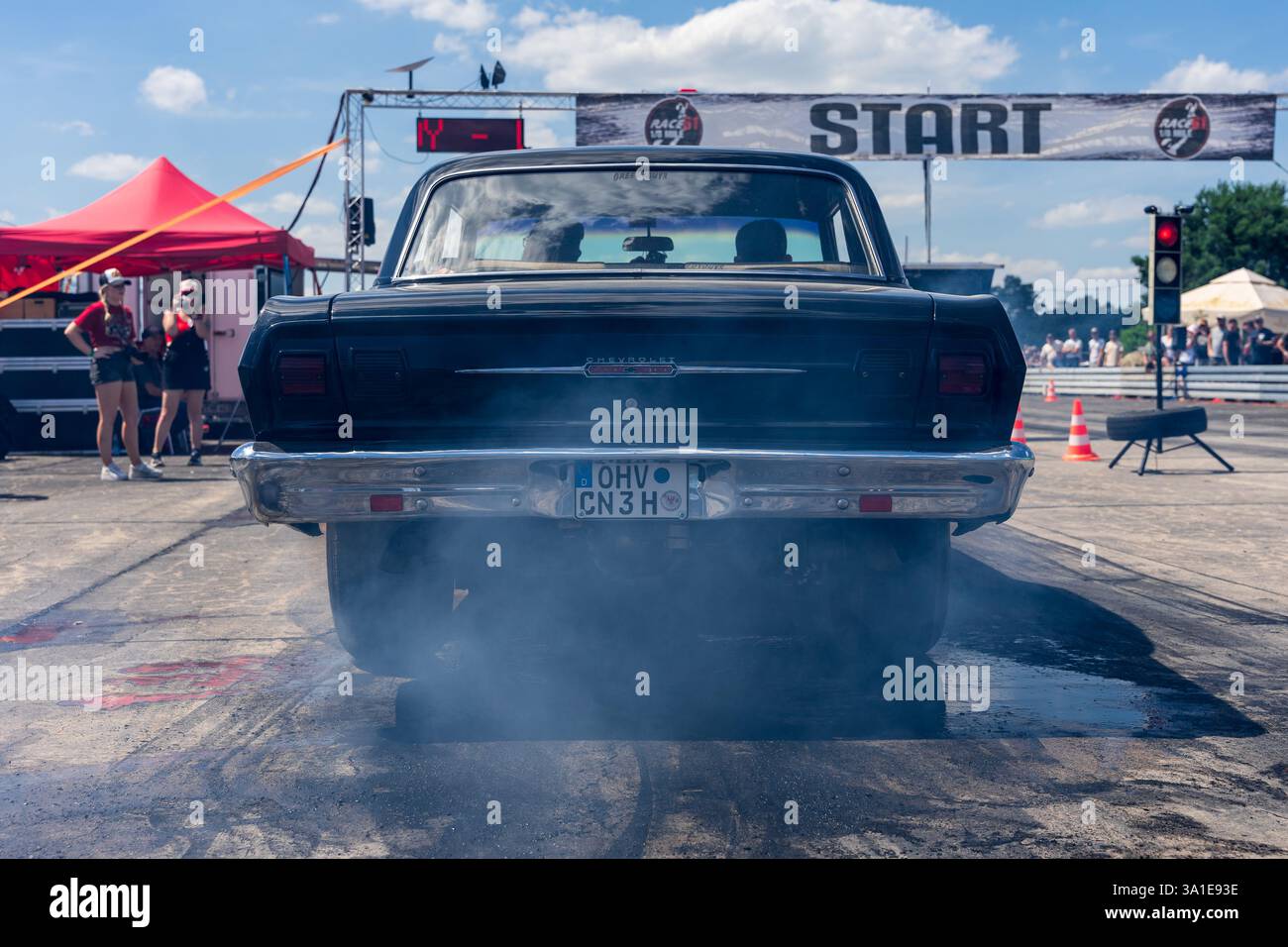 A compact car Chevrolet Chevy II / Nova on the starting line. Getting ...
