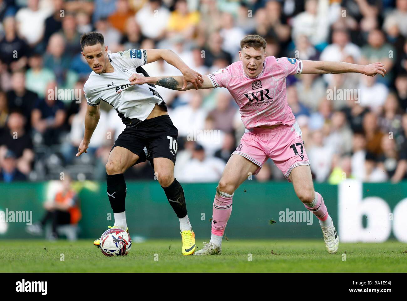 Derby County's Jerry Yates (left) and Blackburn Rovers' Hayden Carter ...