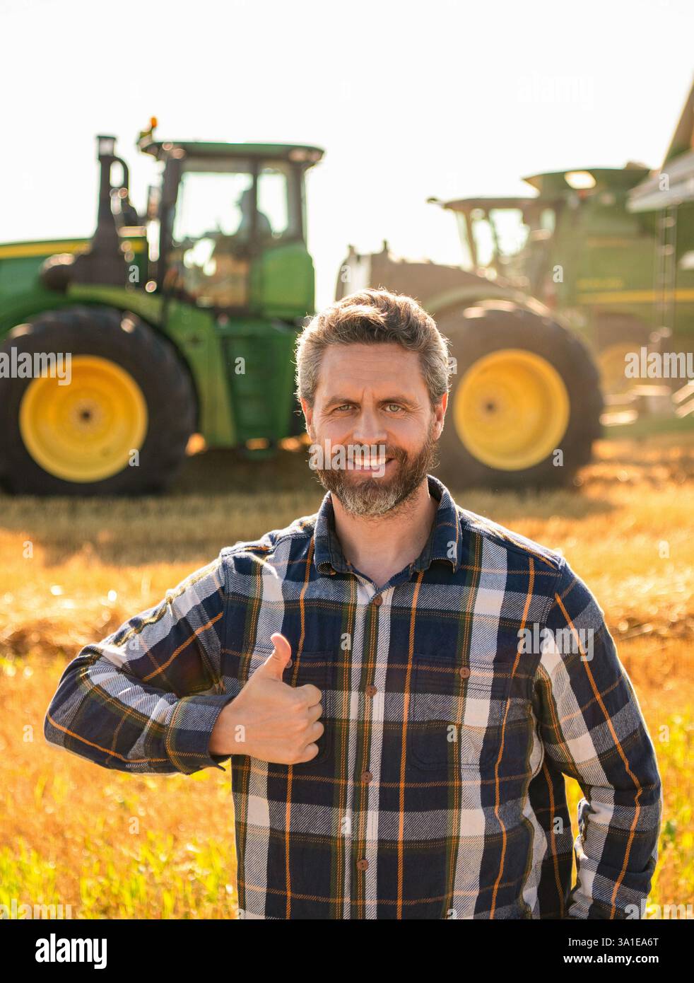 Agronomist man harvesting at crop field. Ripe agriculture. Harvest man ...
