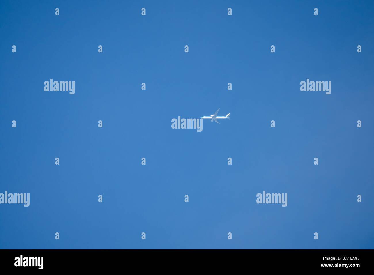 a twin engined jet liner aircraft in deep blue sky Stock Photo - Alamy