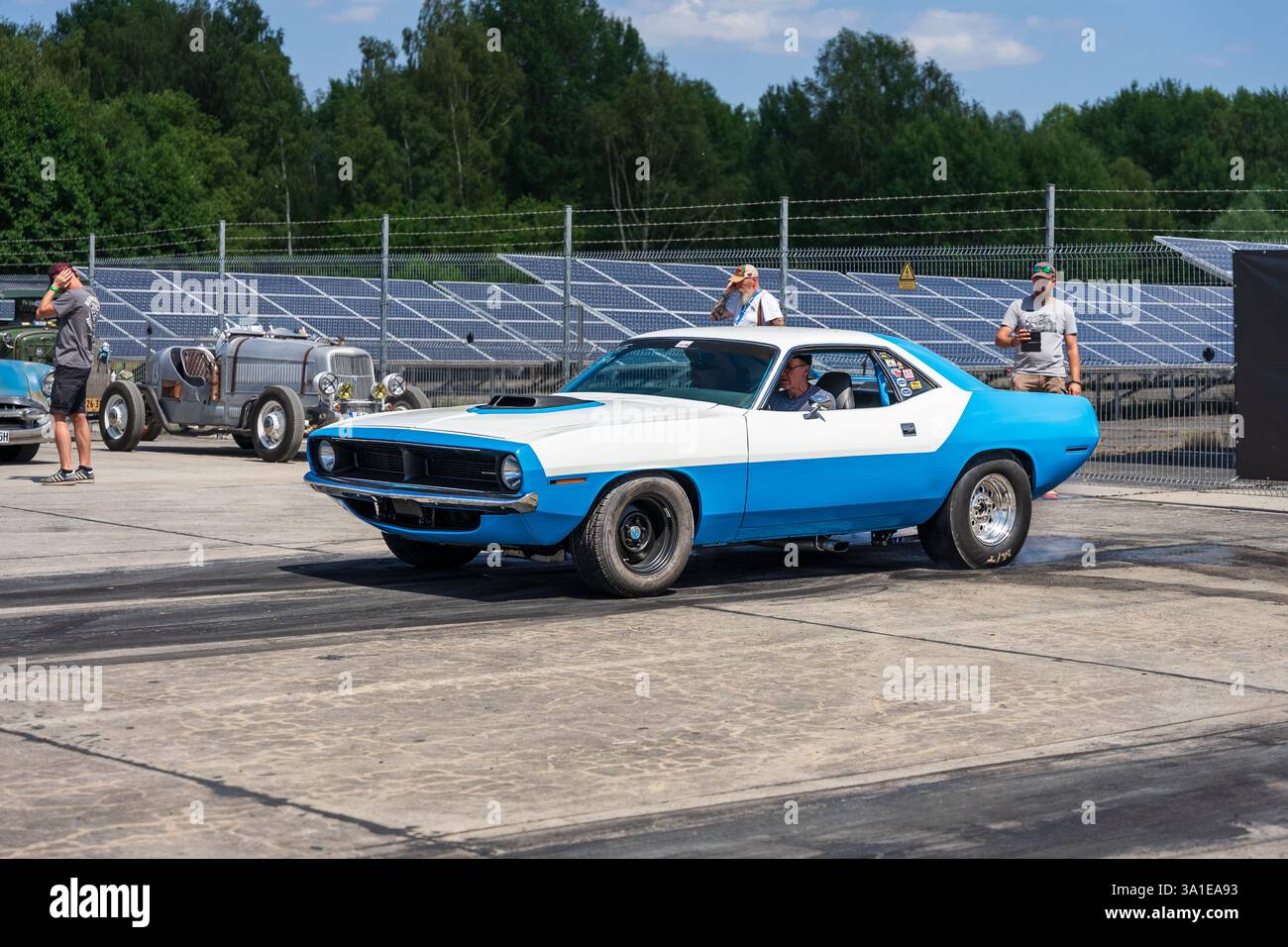 A pony car Plymouth Barracuda (1970) on the starting line. Getting ...