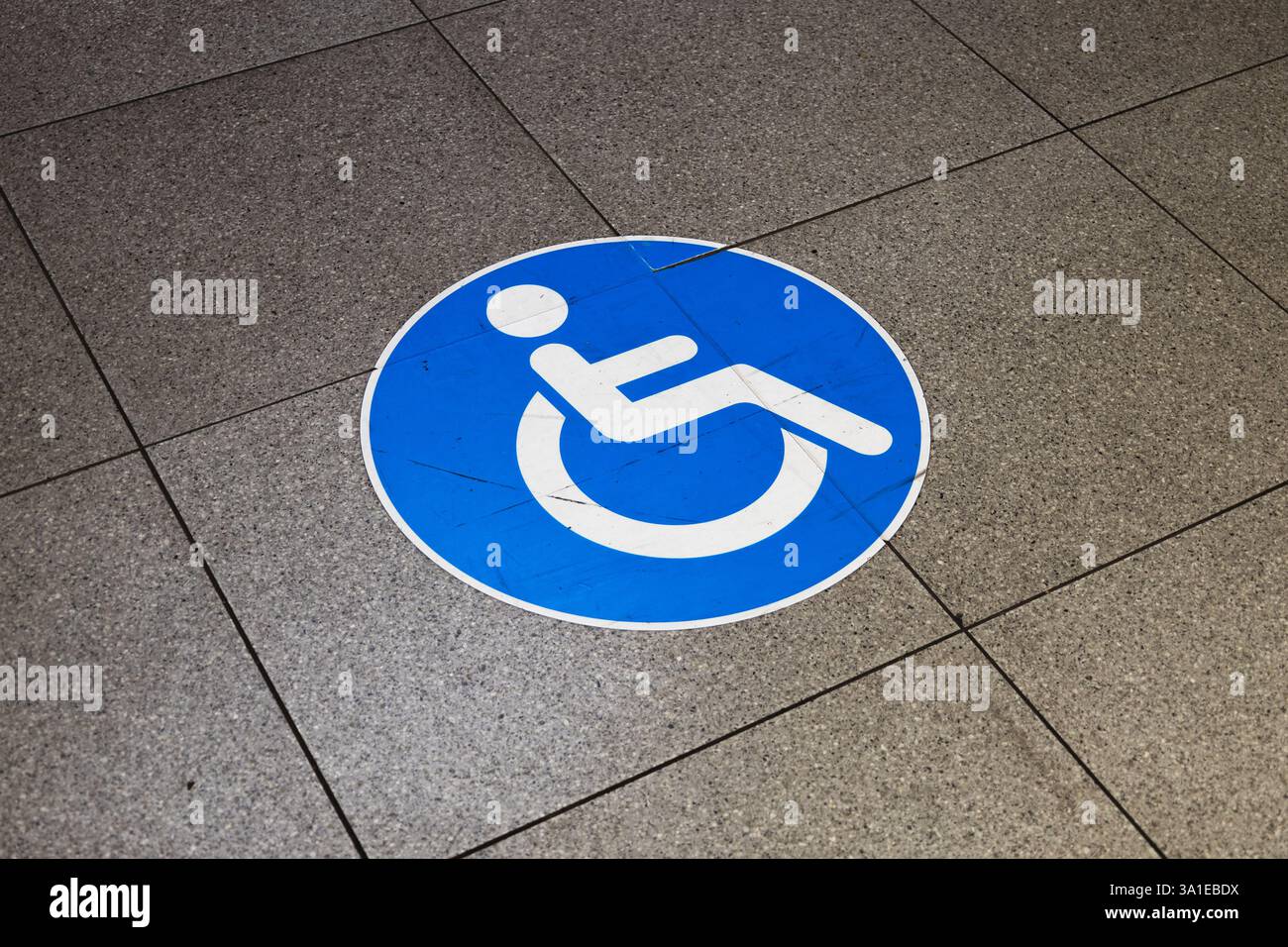 Accessibility Symbol on a Public Floor Indicating Wheelchair Accessible ...