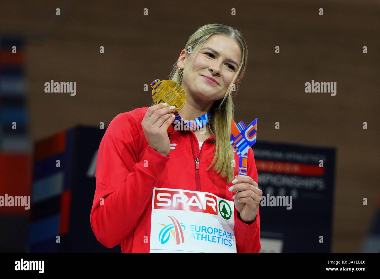 Poland's Pia Skrzyszowska poses with a bronze medal for the 60 meters ...