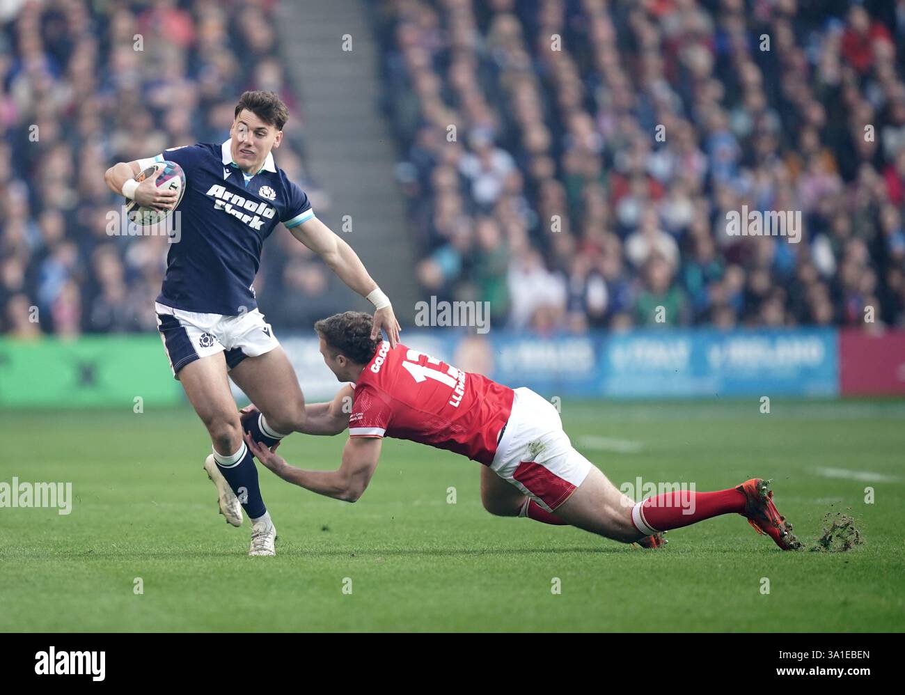 Scotland's Tom Jordan tackled by Wales's Max Llewellyn during the ...
