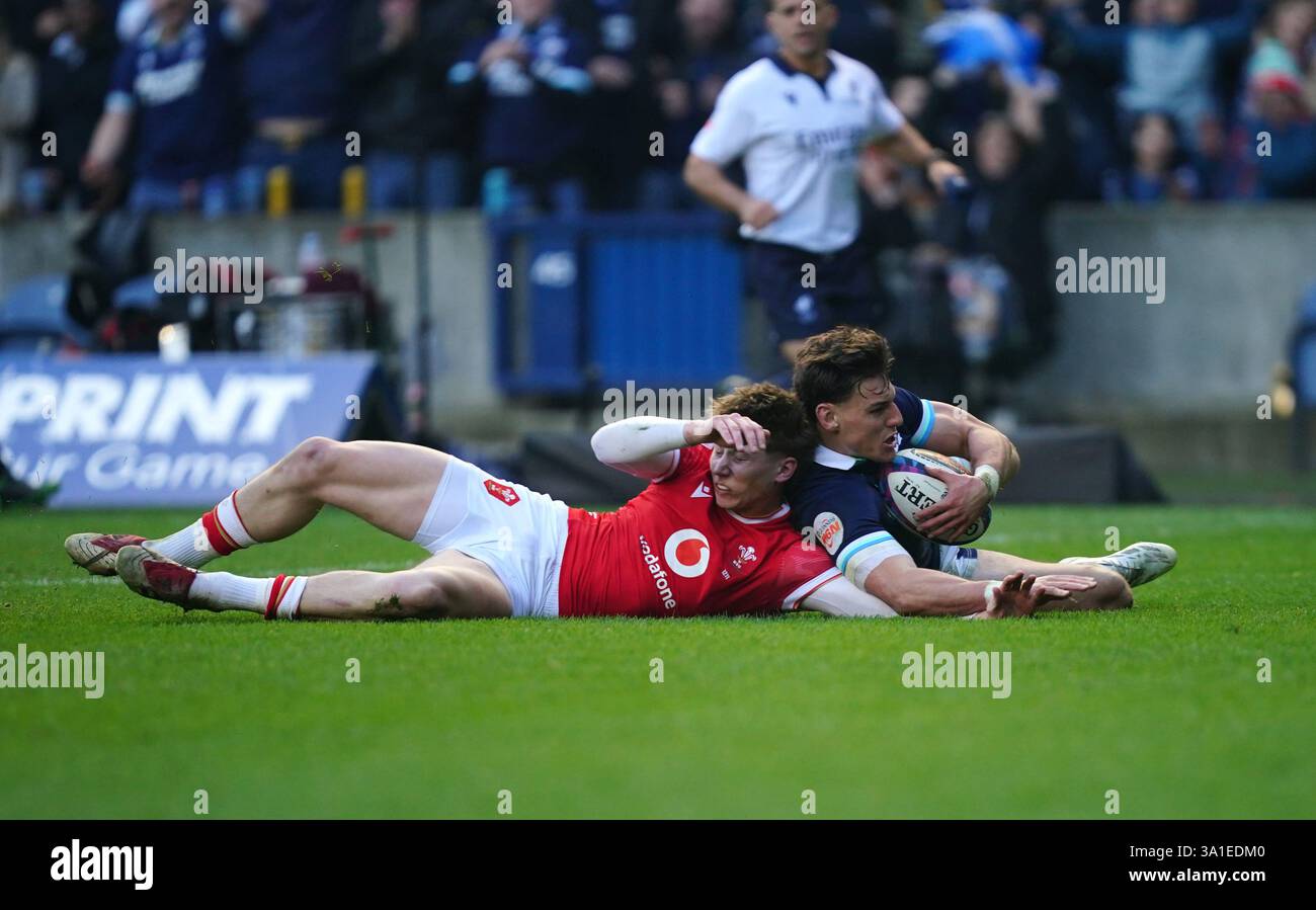 Scotland's Darcy Graham scores their side's fourth try of the game ...