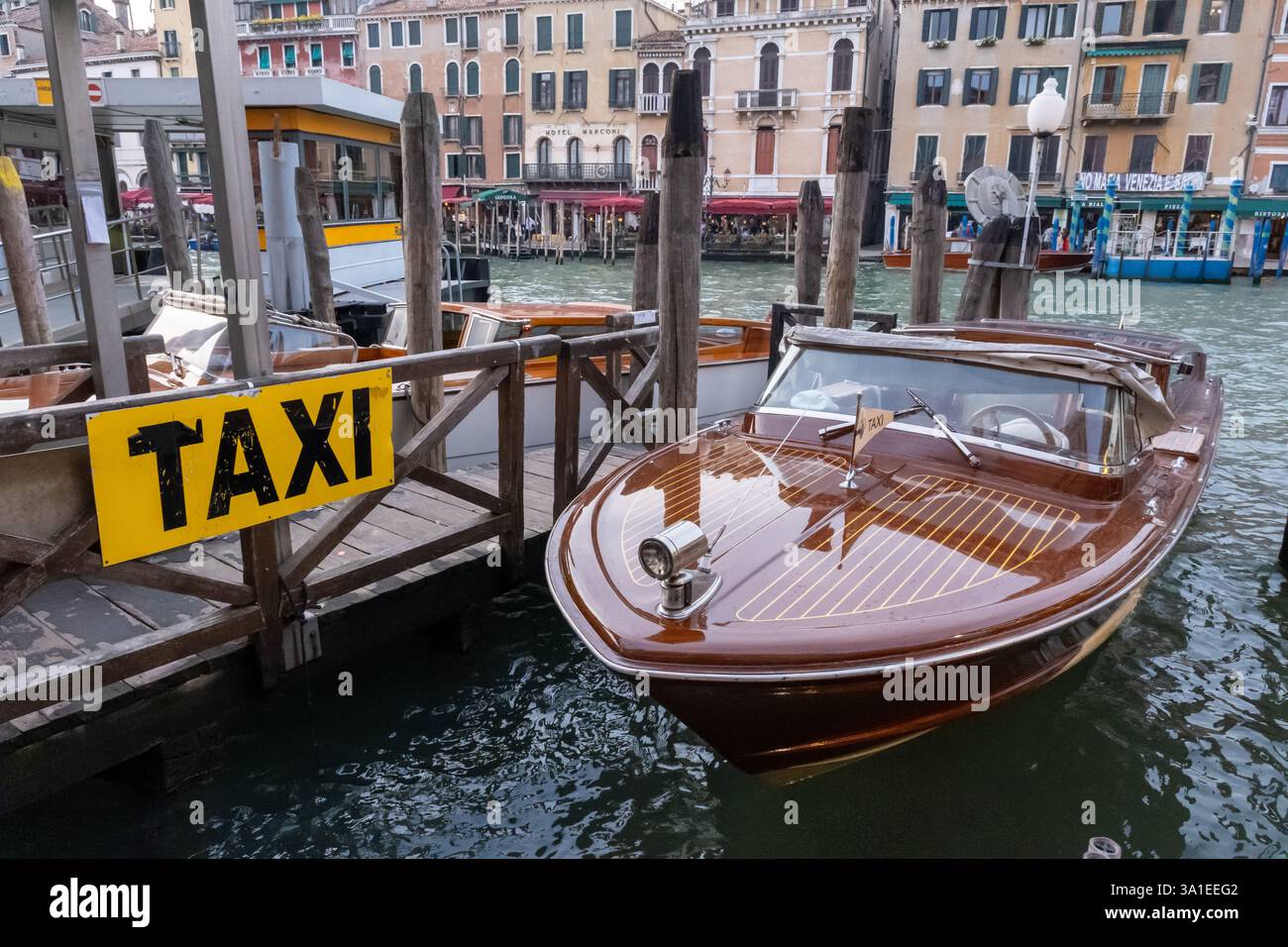 Venice, Italy - 12 October 2024: A classic wooden water taxi docked at ...