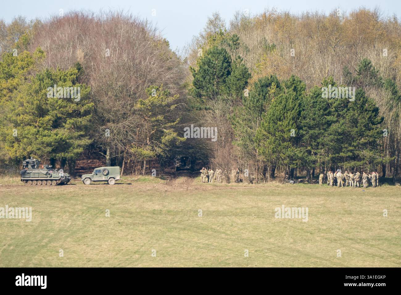 British army infantry soldiers with Land Rover Wolf and Warrior FV512 ...