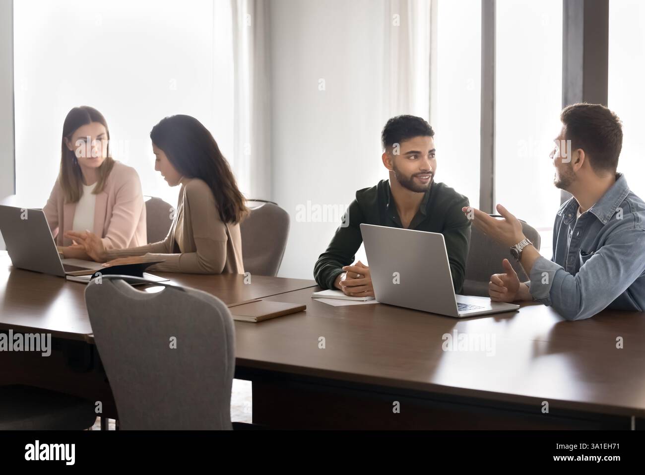 Engaged team members collaborate in hi-res stock photography and images ...